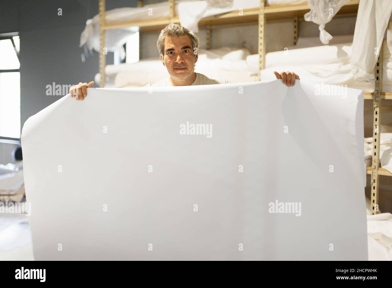 Technician worker operator show and point blank empty space of white ...