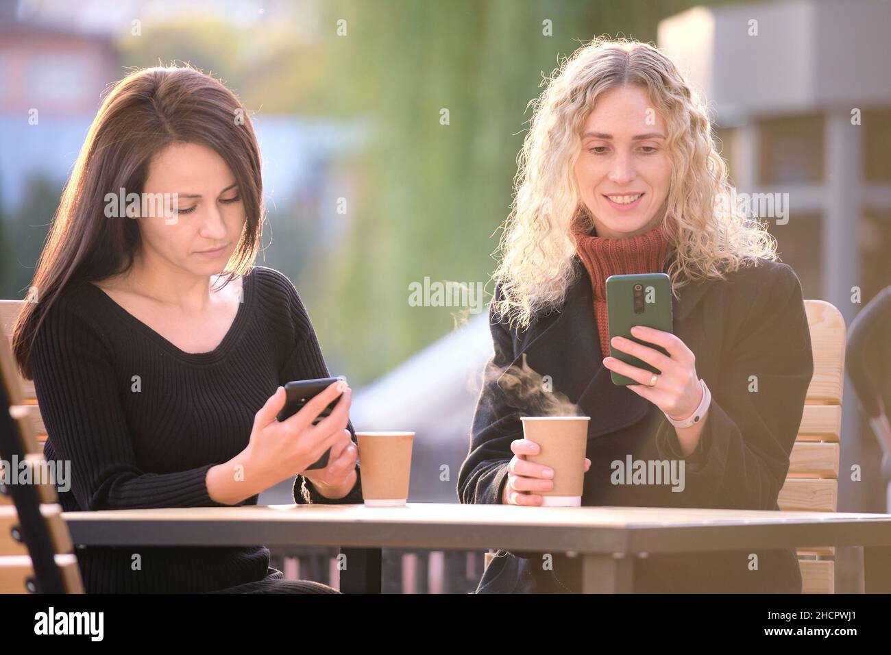 Women using mobile phones ignoring hi-res stock photography and images ...