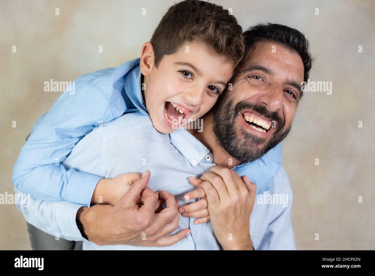 Father and son smiling isolated Stock Photo - Alamy