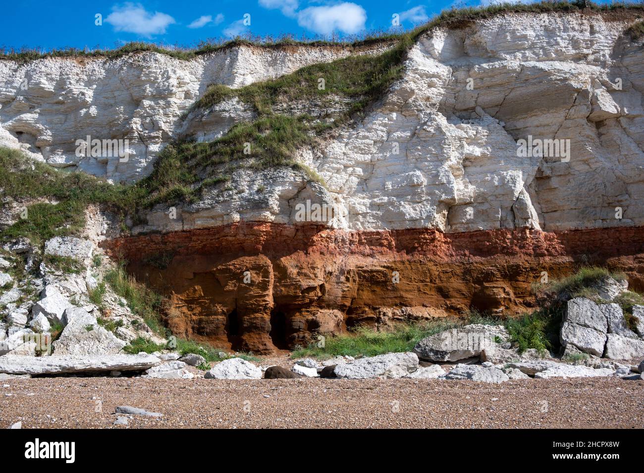 Red and white striped cliffs at Hunstanton, Norfolk, caused by layers ...