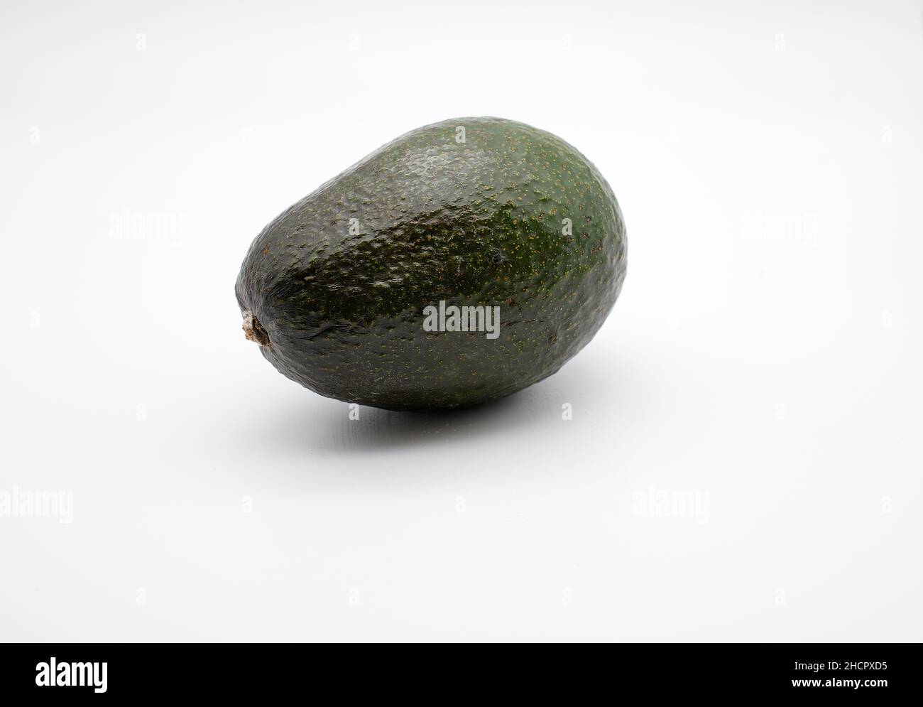 Fresh Avocado fruit on a white background, NOT cut out Stock Photo - Alamy