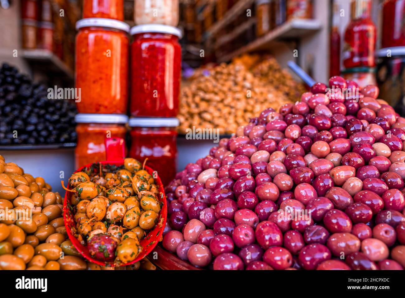 Different varieties of olives for sale at local food store or bazaar ...