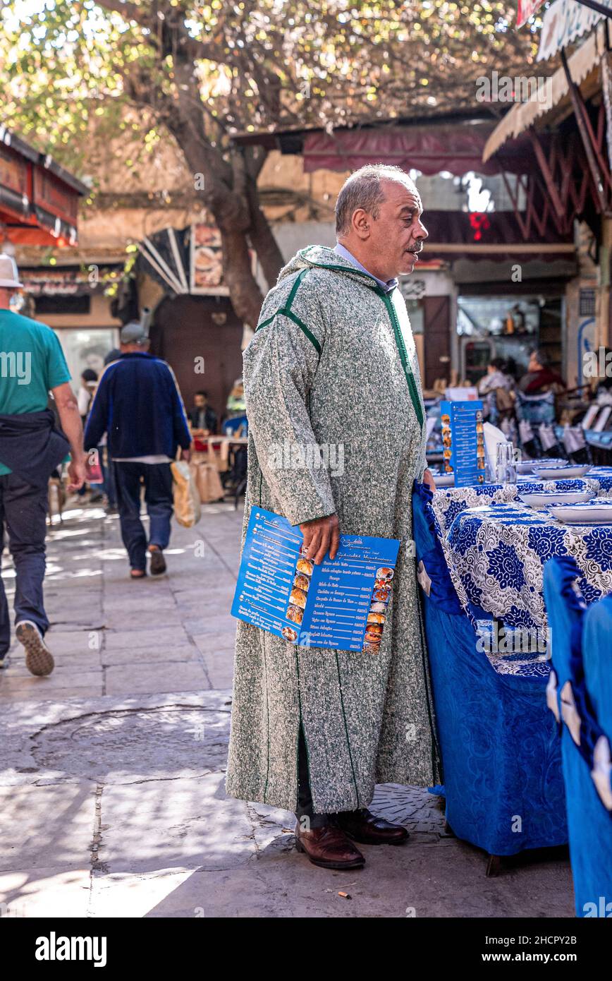 Man holding menu card and looking at street food cafe stall Stock Photo ...