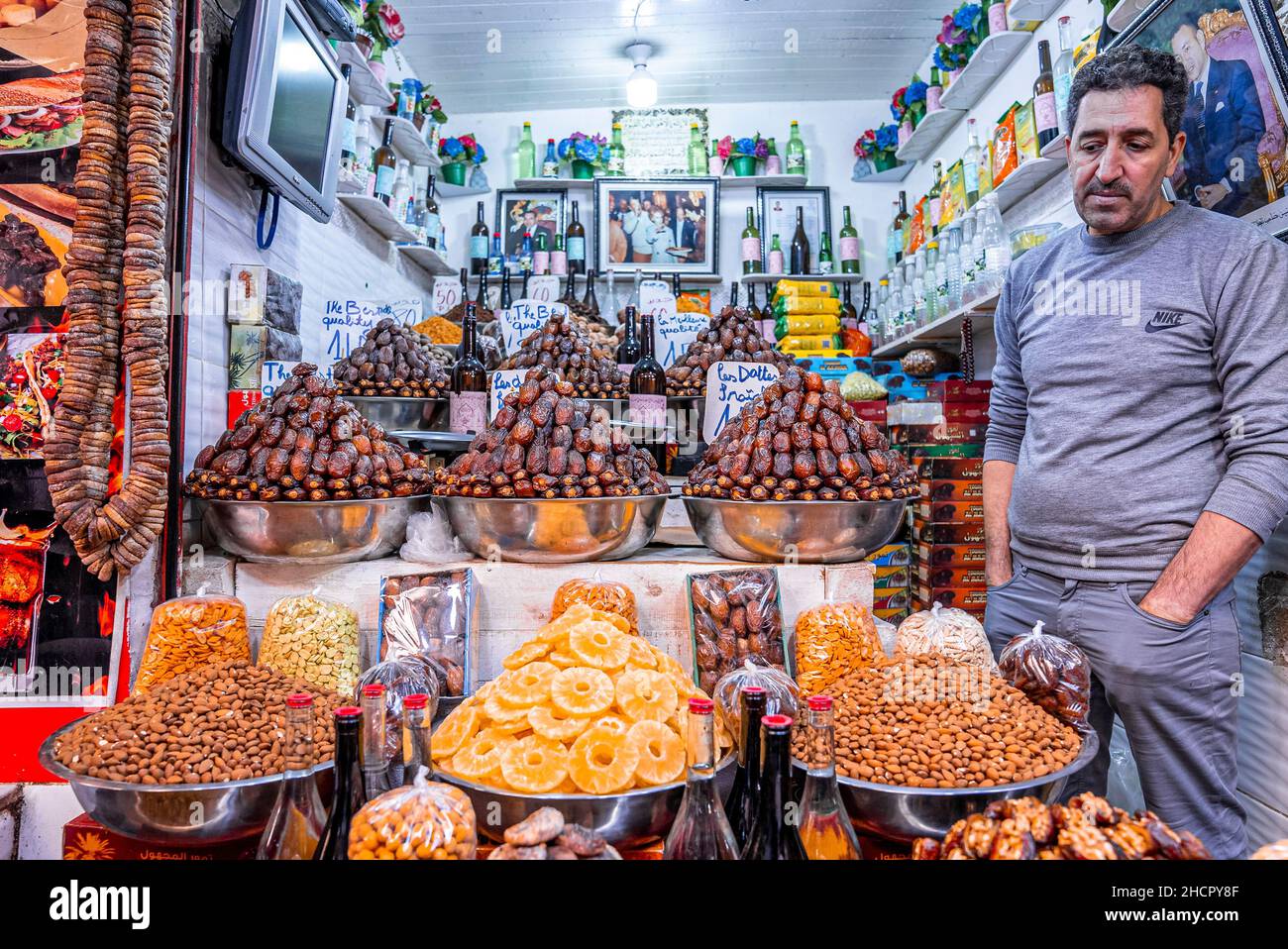 Vendor selling dates and dried fruits in the shop at marketplace Stock ...