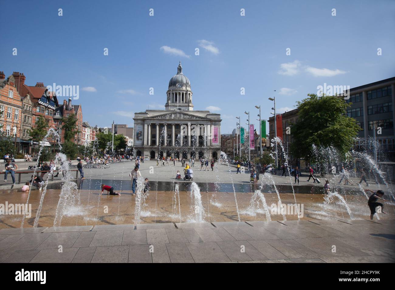 Children playing in the water fountain at Old Market Square in ...