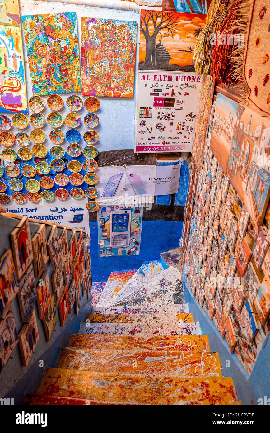 Colorful picture frame and plates on wall at local bazaar Stock Photo ...