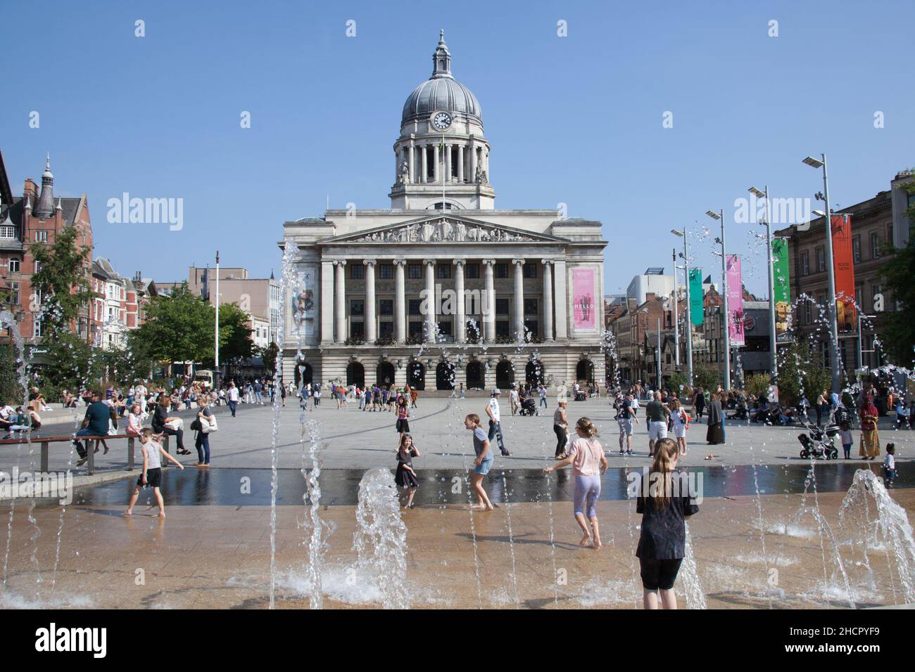 Children playing in the water fountain at Old Market Square in ...