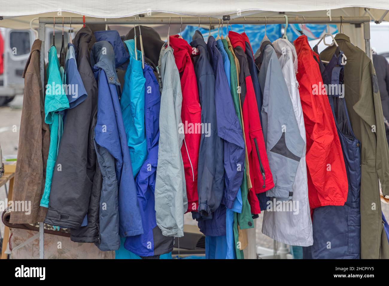 Rain Coats Jackets Gear Clothing for Bad Weather Rack Stock Photo - Alamy