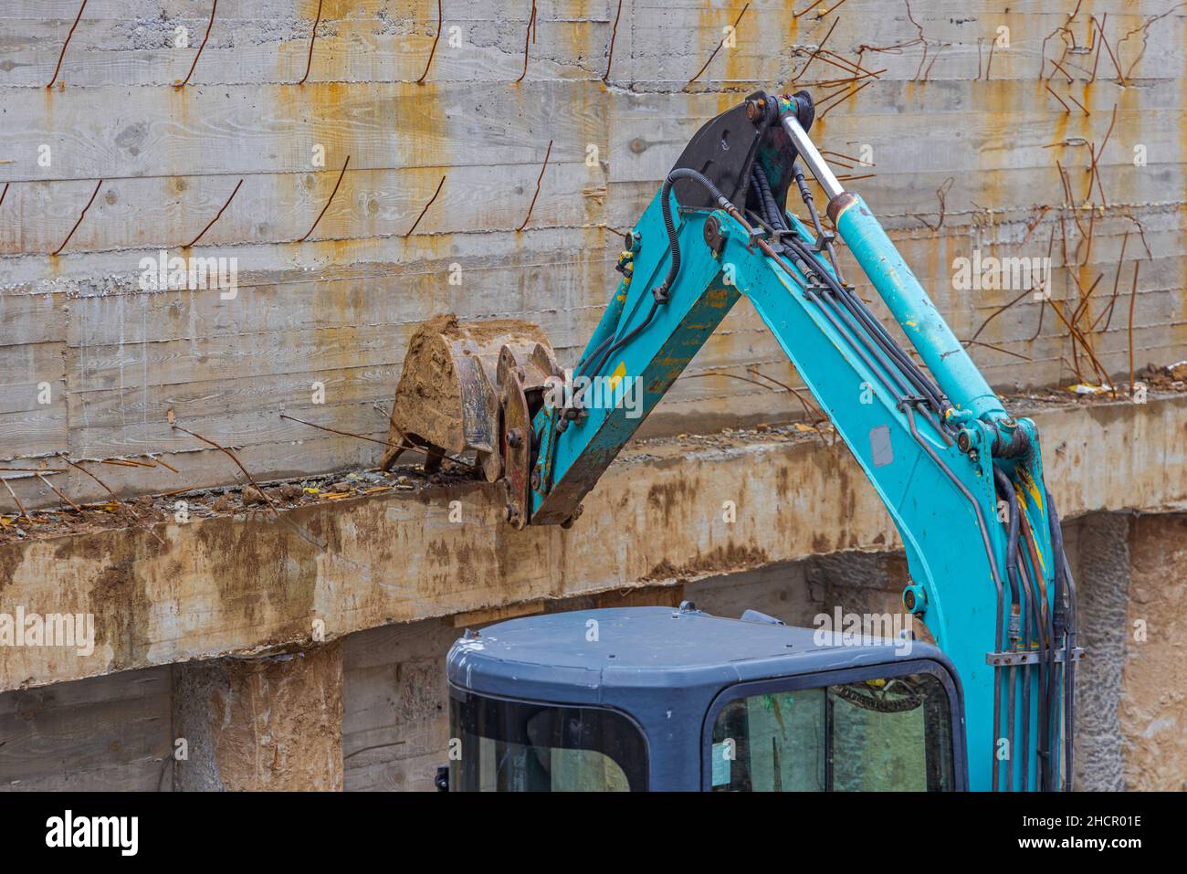 Small Digger Machine in Underground Basement Concrete Construction Site ...
