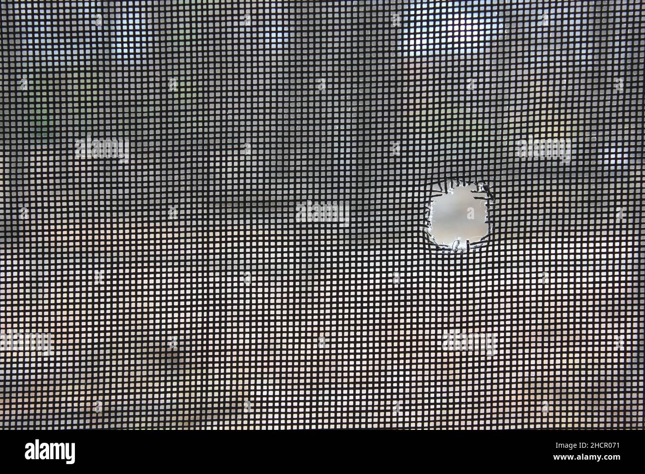 Screen with a bullet hole Stock Photo - Alamy