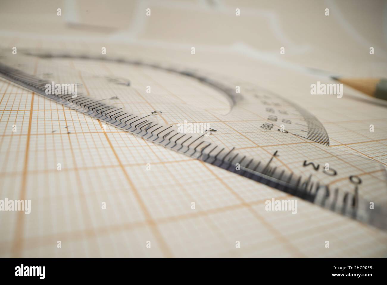 Math concept - macro of a pencil on a piece of paper with geometric ...