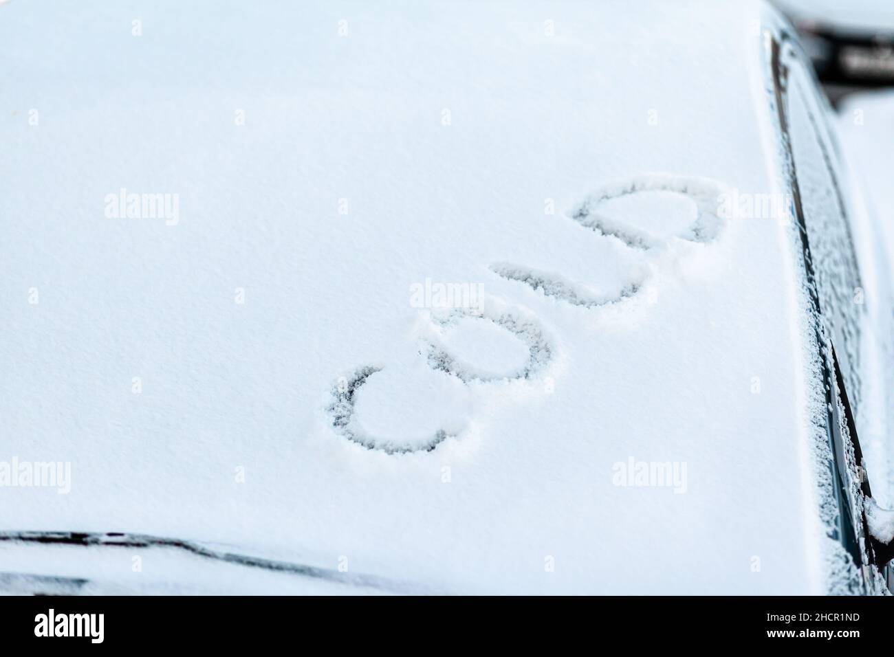The word cold written on a frozen car screen. Cold written on front ...