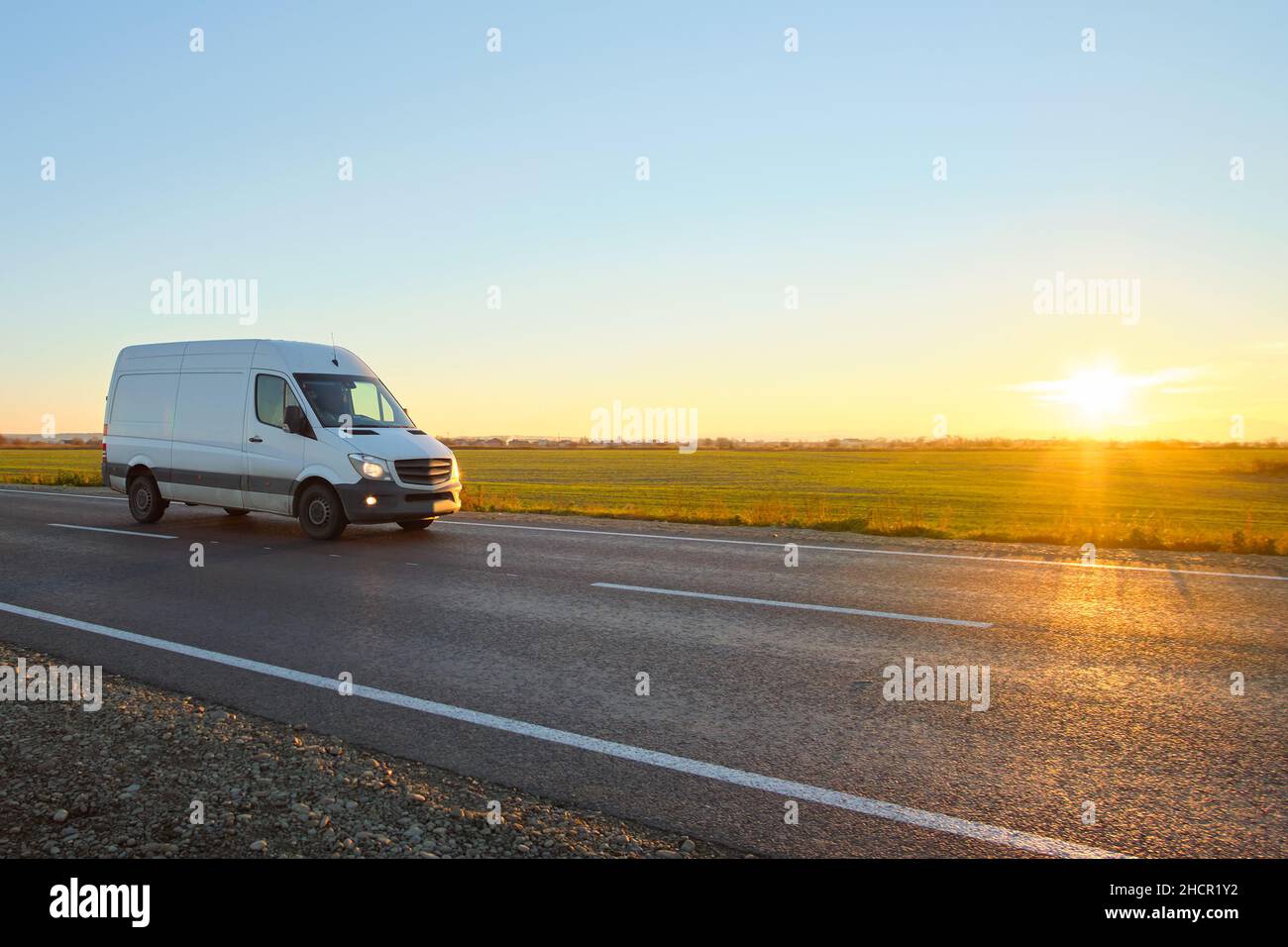 Small cargo van driving on highway hauling goods. Delivery ...