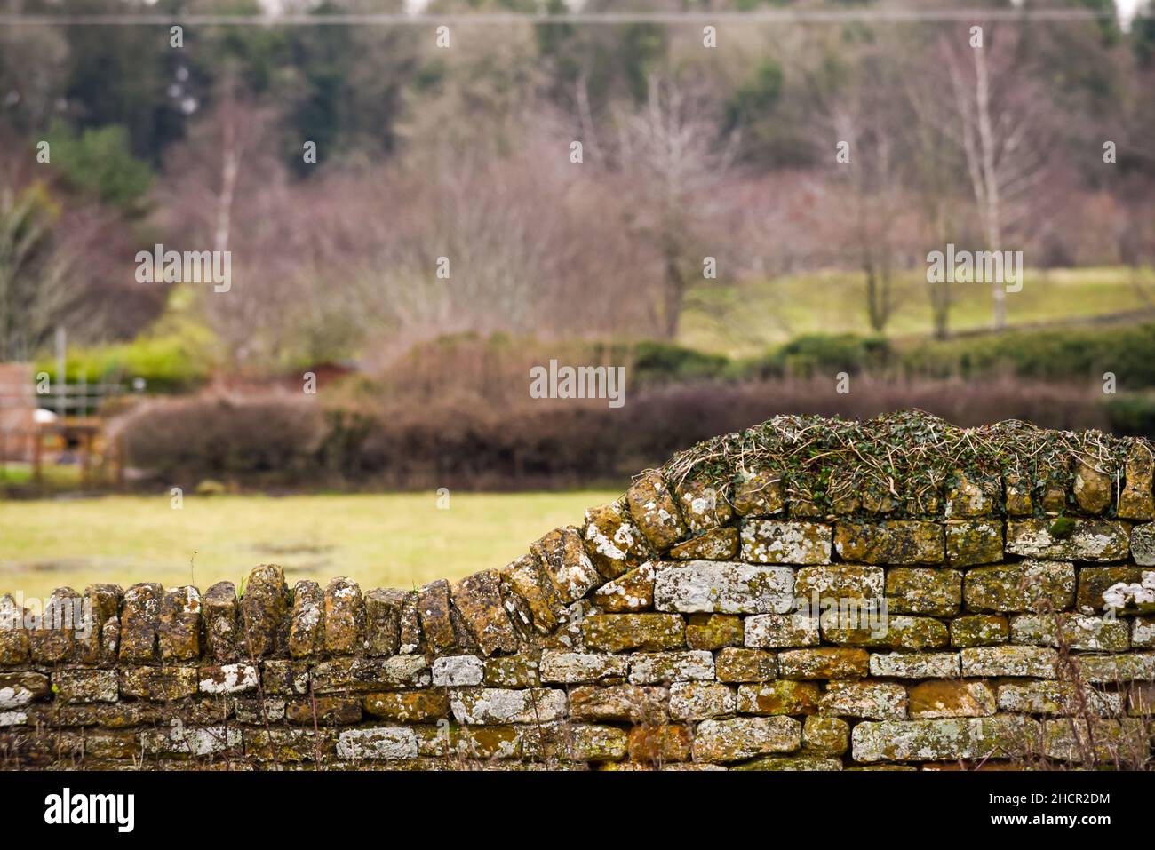 Old fashioned stone wall dividing land and fields Stock Photo - Alamy