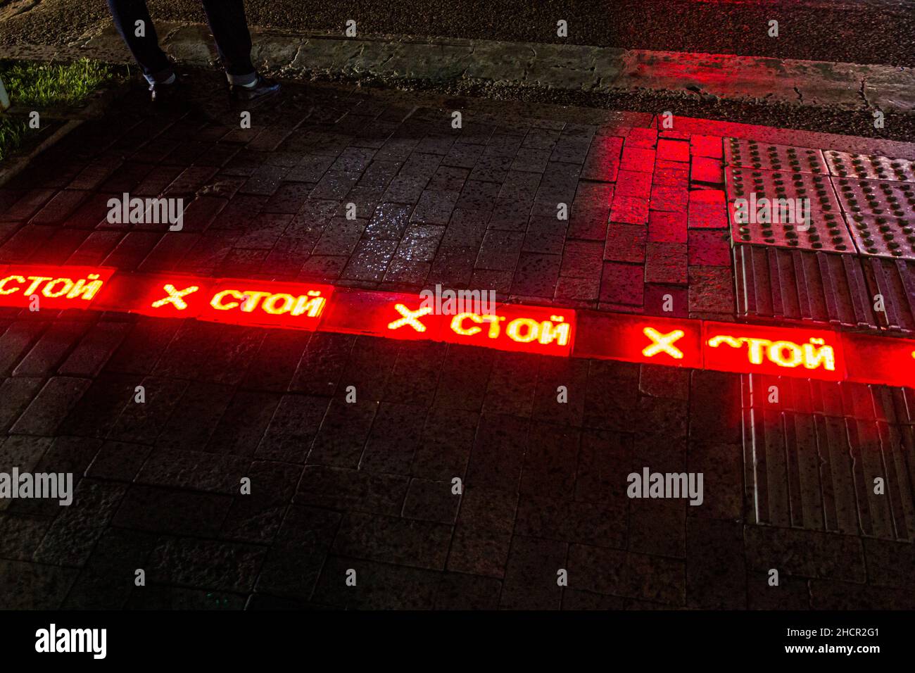 Light sign stop written in Russian at the pedestrian crossing Stock ...