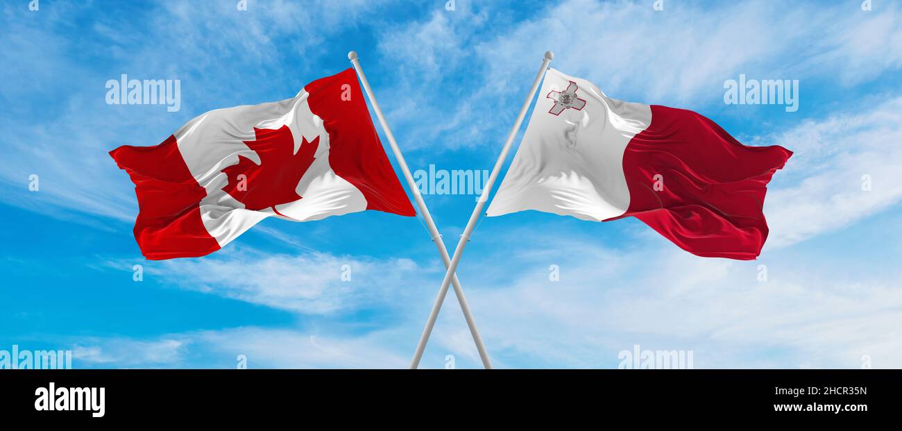 crossed national flags of Canada and Malta flag waving in the wind at ...