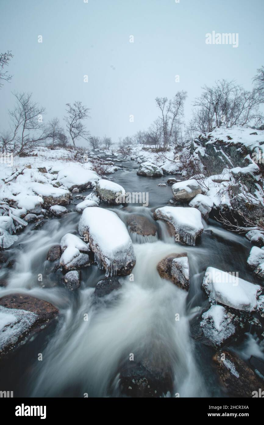 Ice cascades on a fast flowing river in Kilpisjarvi, Lapland, Finland ...