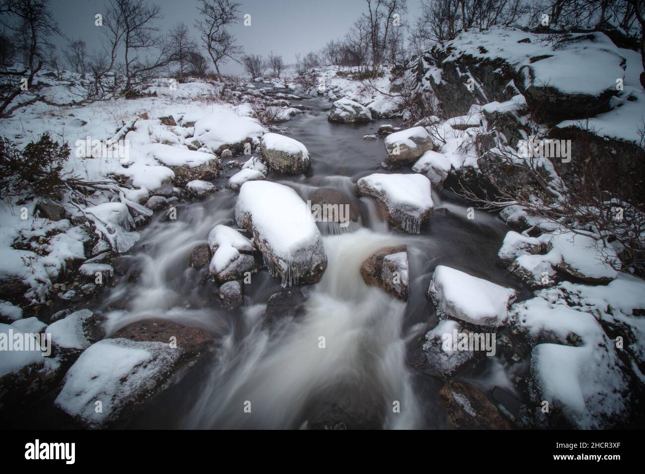 Ice cascades on a fast flowing river in Kilpisjarvi, Lapland, Finland ...
