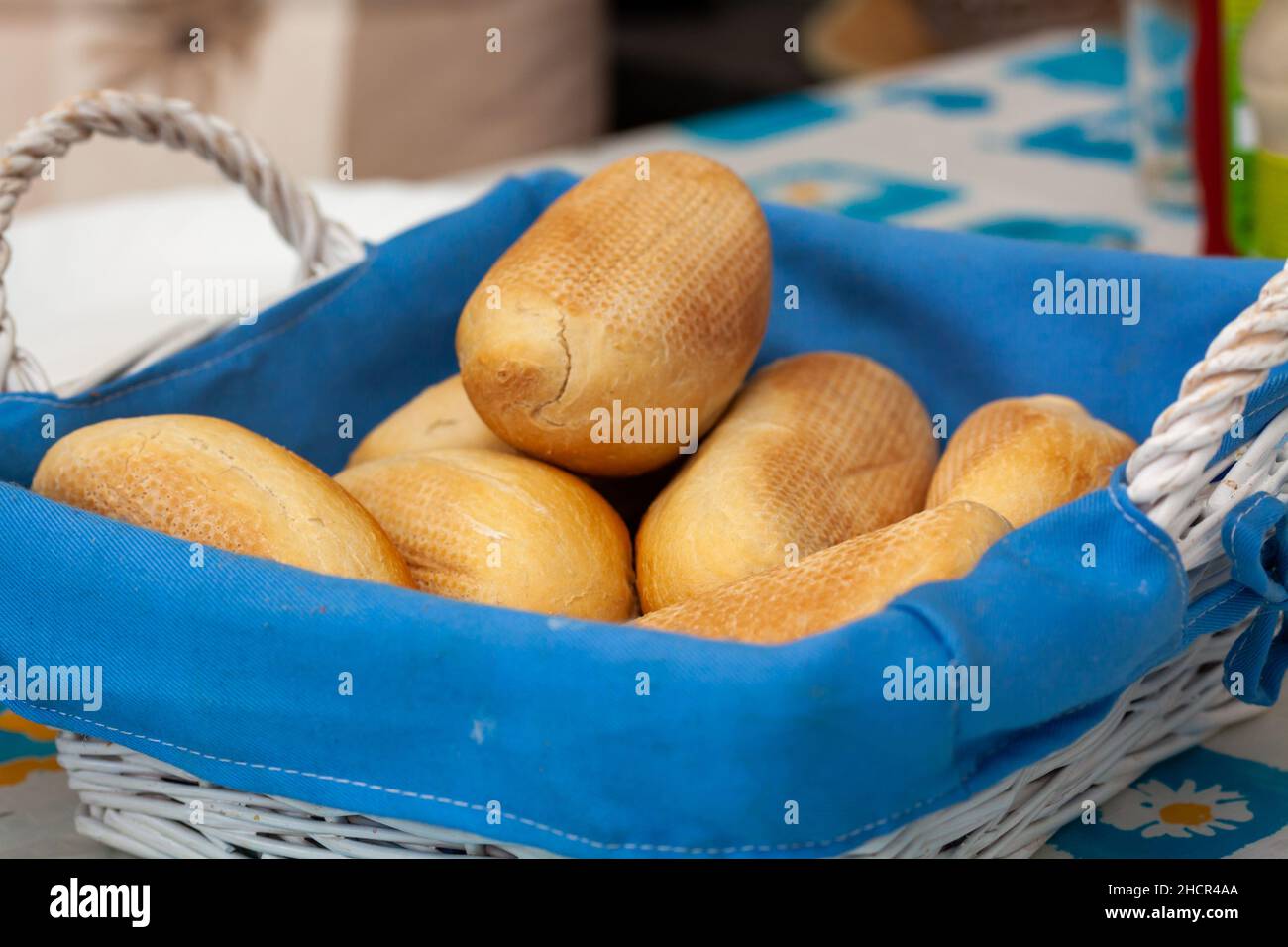 Selective of bread loaves in a blue basket Stock Photo - Alamy