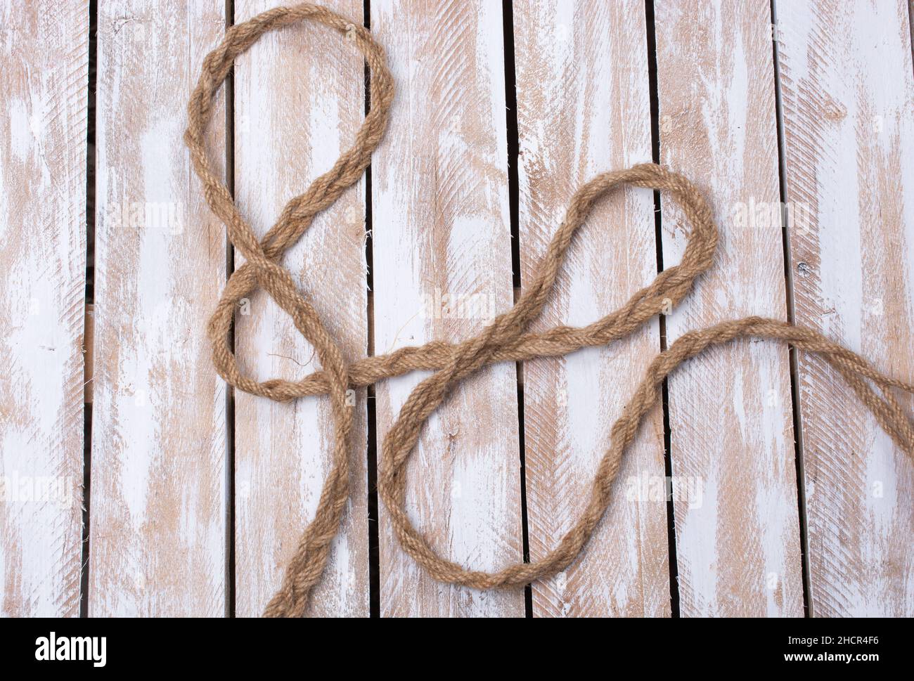 Top view of a rope on a wooden panel surfac Stock Photo - Alamy