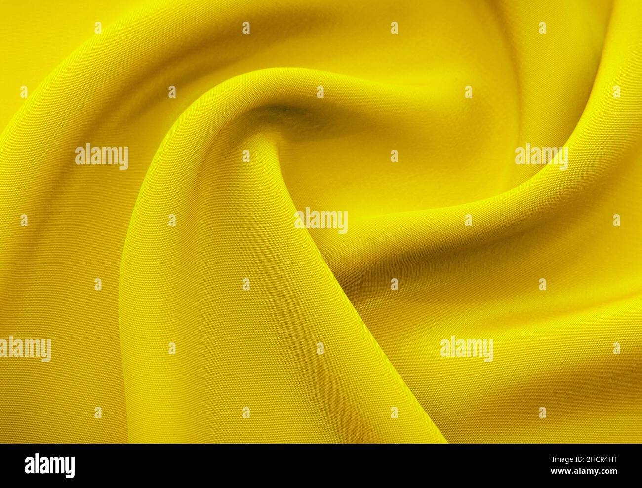 Background from a crumpled piece of yellow fabric with waves. Textile ...