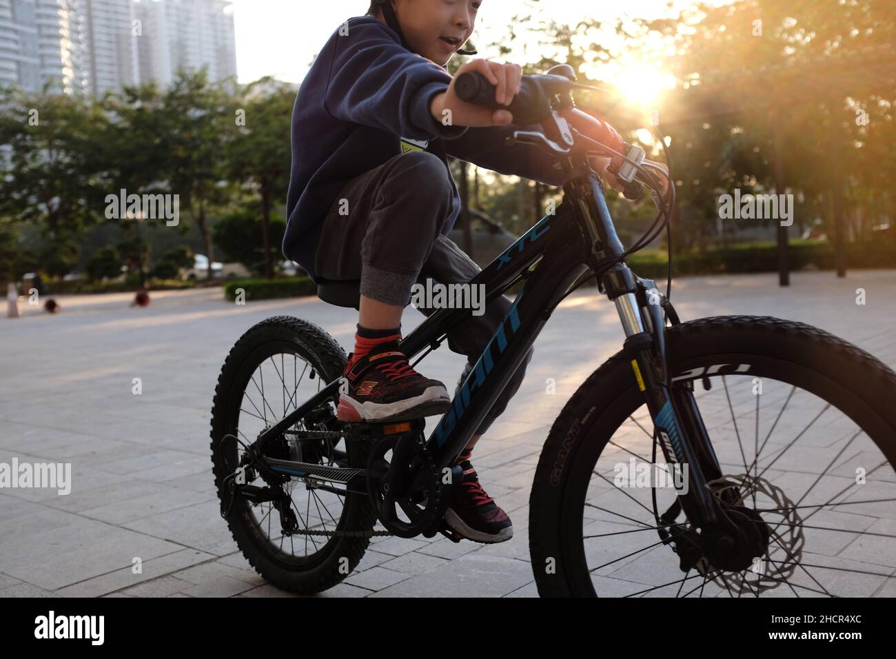 Boy on bicycle Stock Photo - Alamy