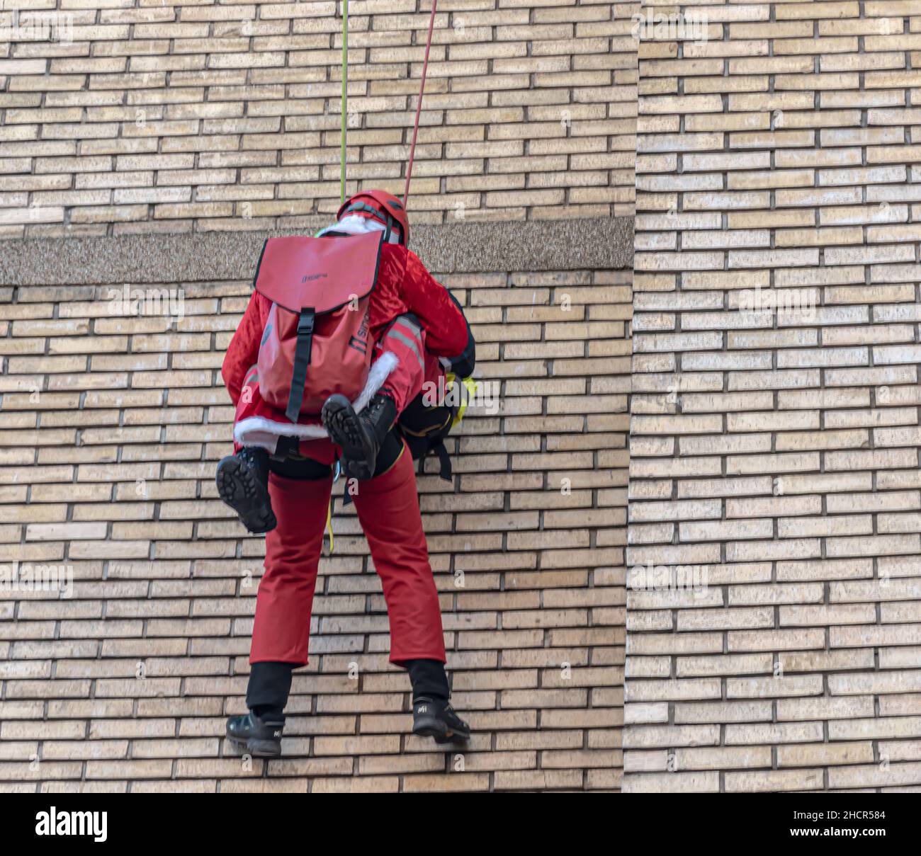 The rescuer safely dropped Santa Claus on the street Stock Photo - Alamy
