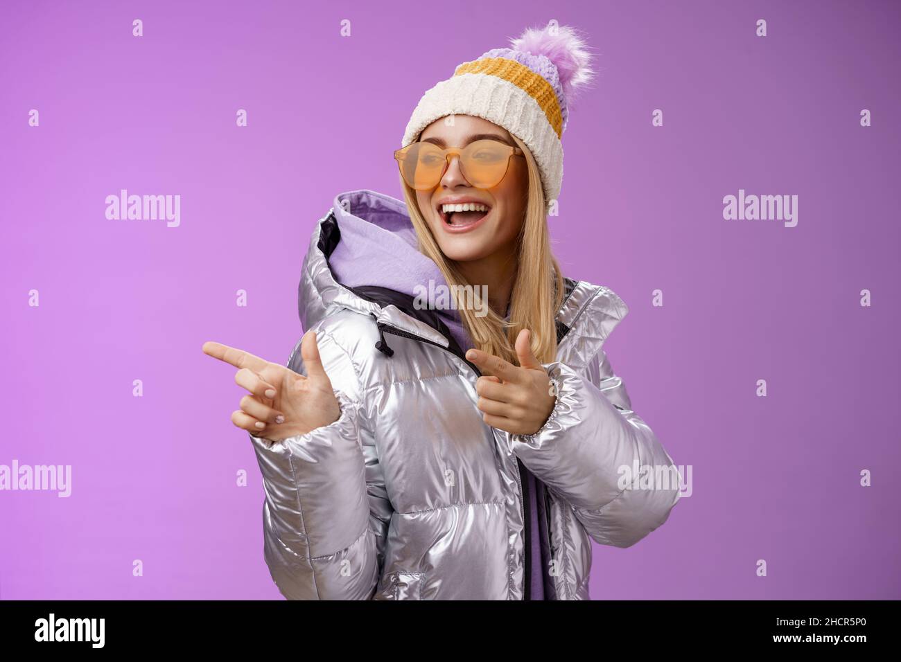 Hey how you doin. Cheeky stylish bond girl having fun greeting friend ...