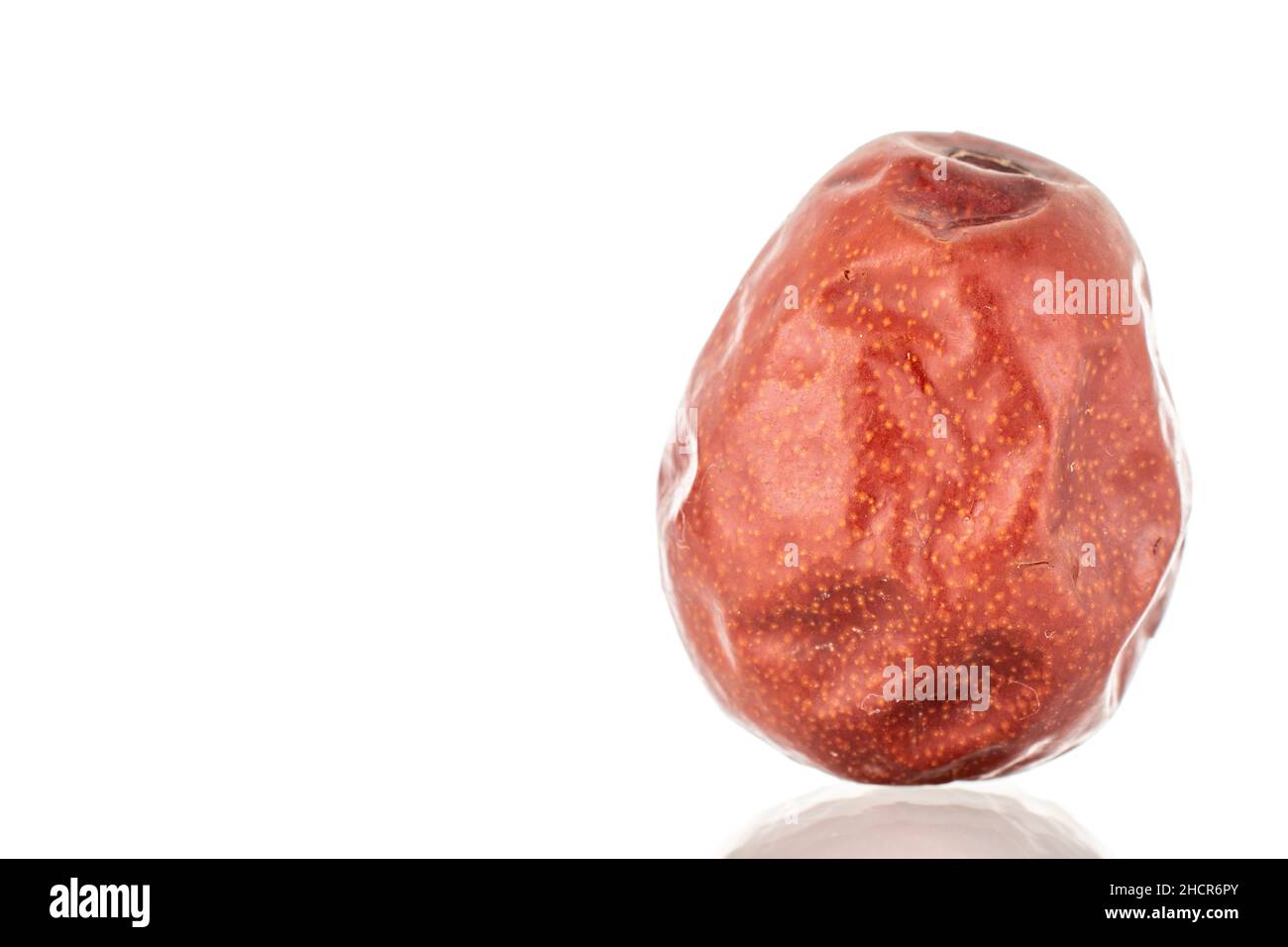 One dried unabi berry, close-up, isolated on white Stock Photo - Alamy