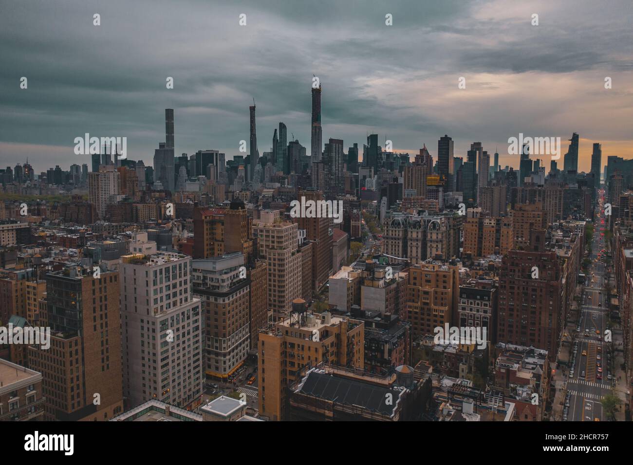 Bird's eye view of the skyscrapers and traffic on a cloudy day in New ...