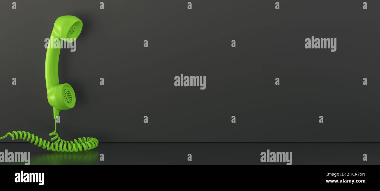 Shot of a green landline telephone receiver with copy space for ...