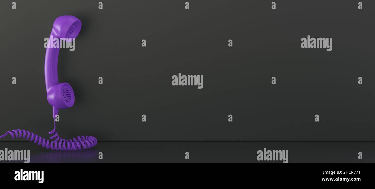 Shot of a purple landline telephone receiver with copy space for ...