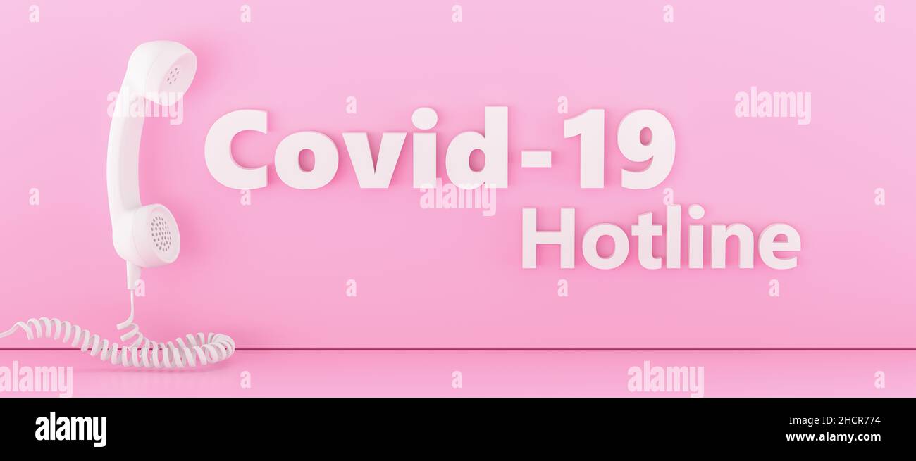 Hotline Landline telephone in front of a color wall background. Corona ...