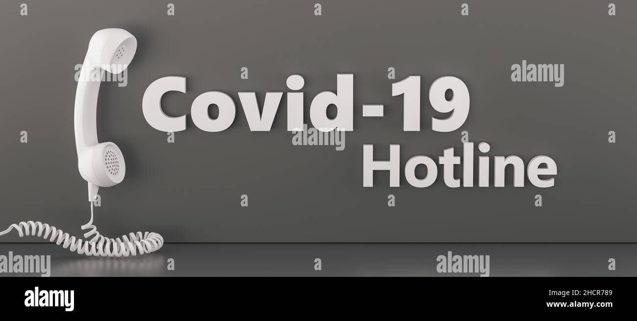 Hotline Landline telephone in front of a color wall background. Corona ...