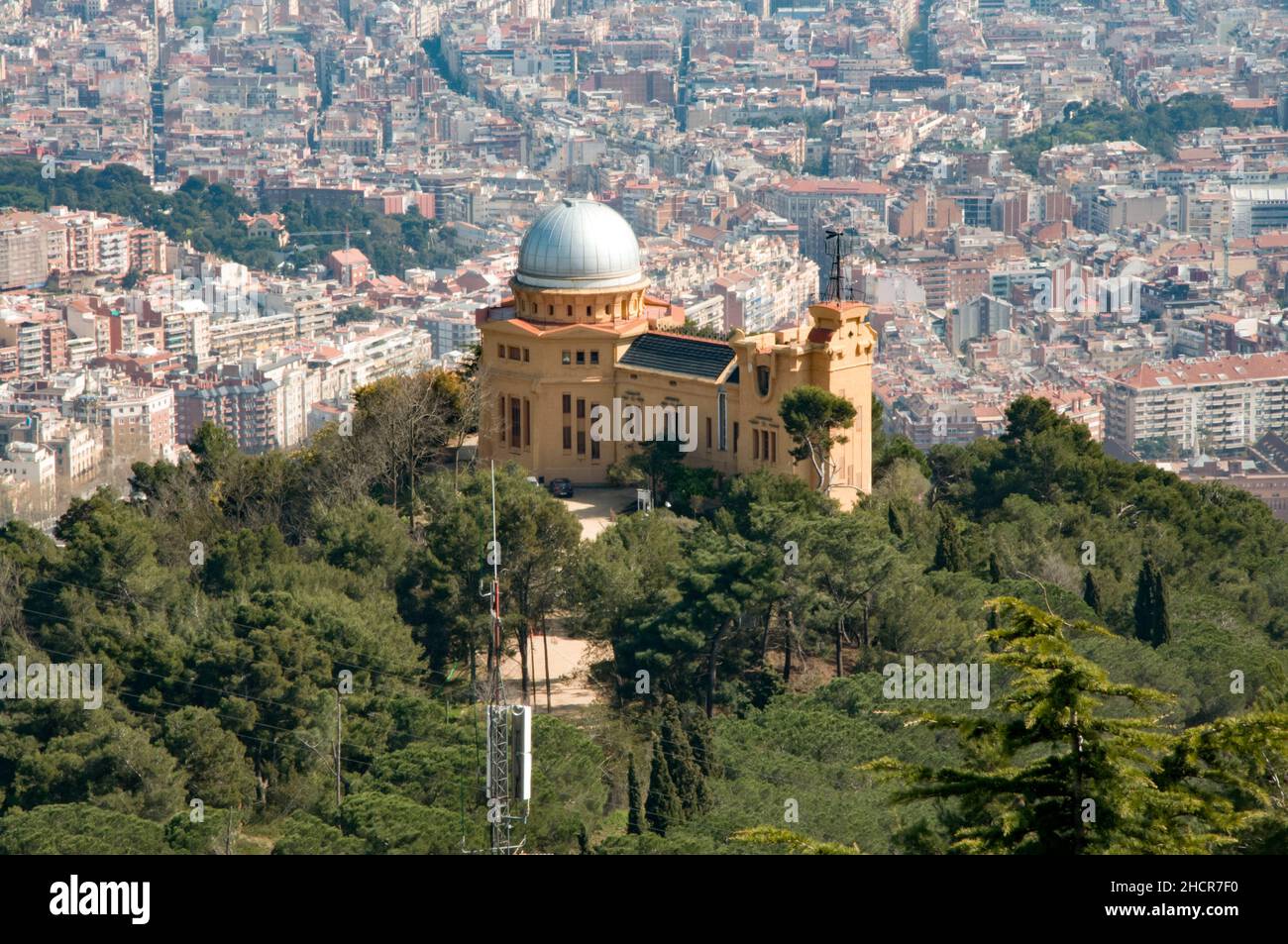 Bird's eye view of Fabra observatory on the top of a mountain on a ...