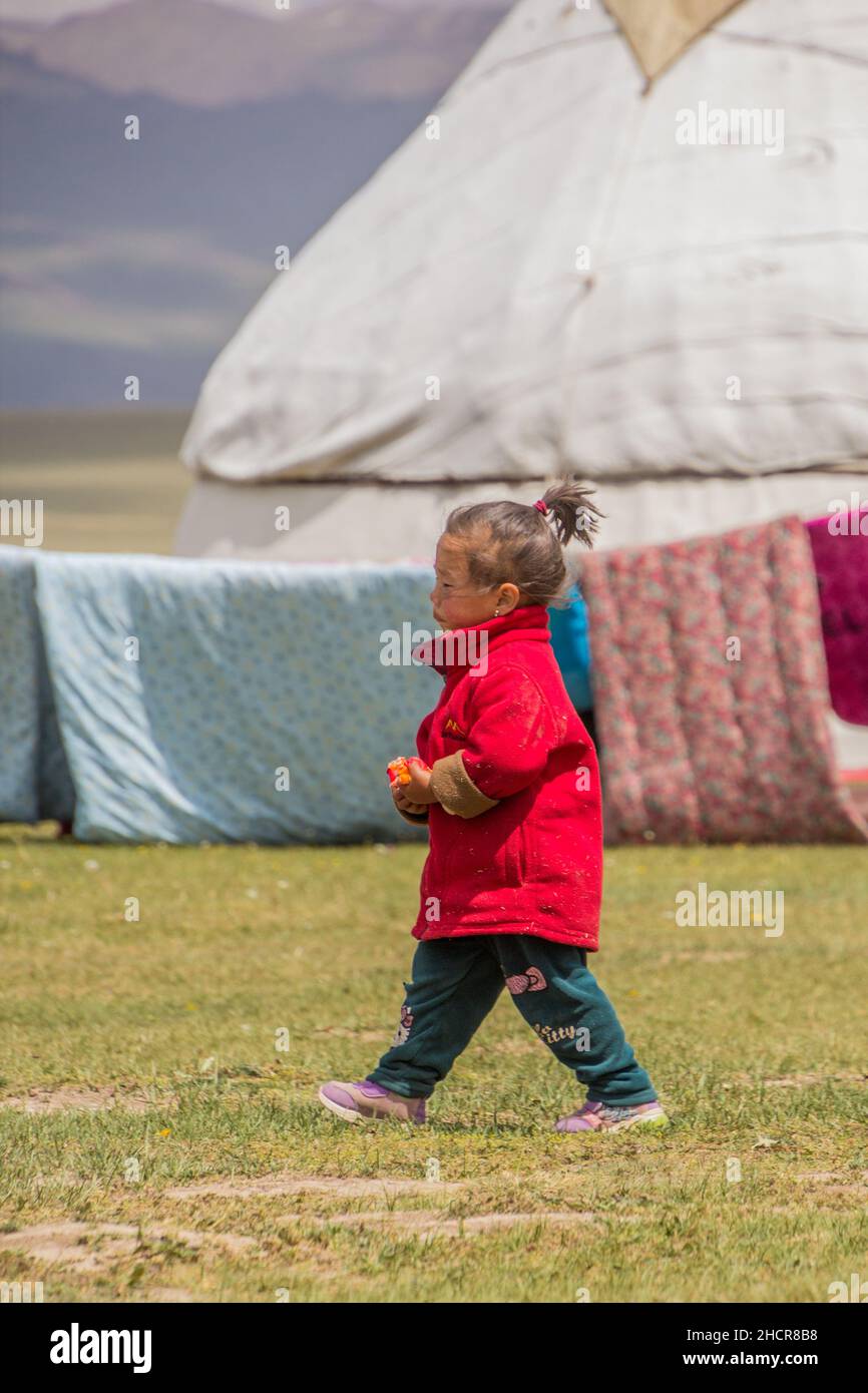 SONG KUL, KYRGYZSTAN - JULY 24, 2018: Young Kyrgyz girl in an yurt camp ...