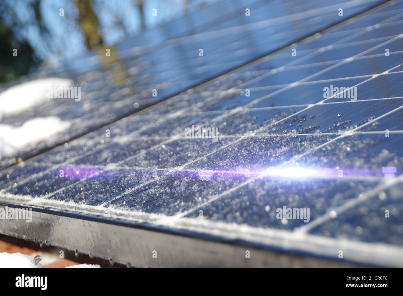 Solar panels covered by frozen ice and snow. Photovoltaic electricity ...