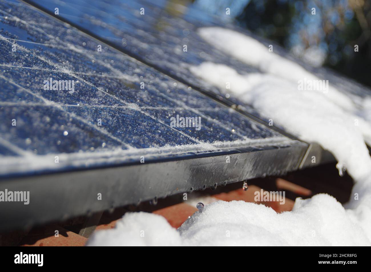 Solar panels covered by frozen ice and snow. Photovoltaic electricity ...