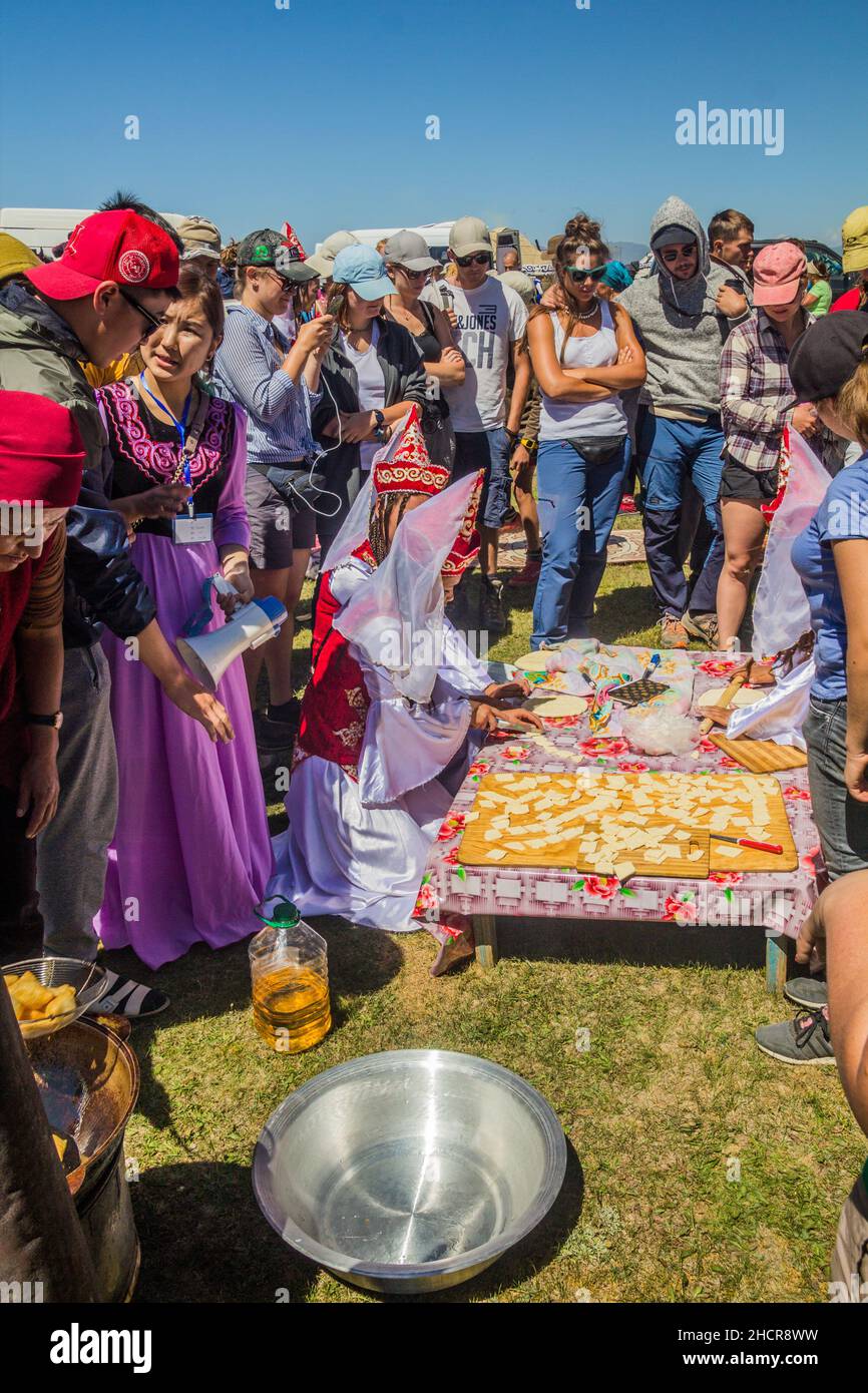 SONG KOL, KYRGYZSTAN - JULY 25, 2018: Cooking of boorsok, fried dough ...