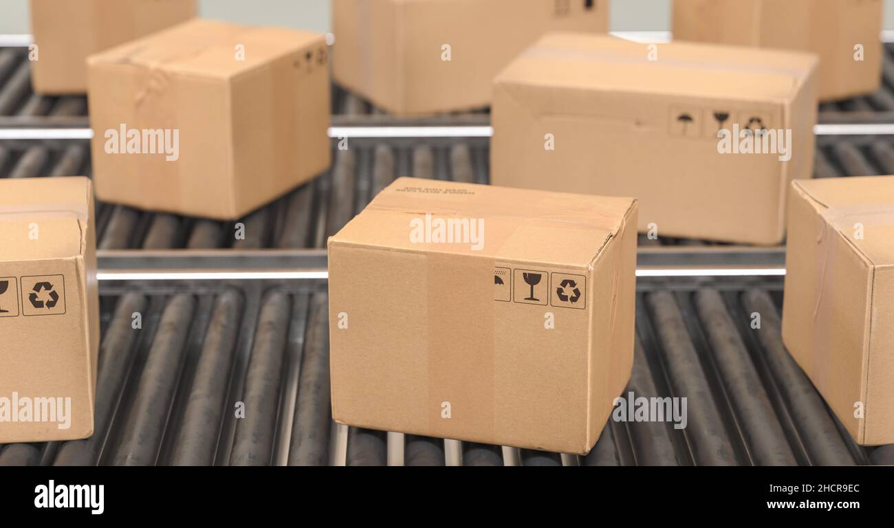 Cardboard boxes on a conveyor line, Delivery concept image Stock Photo ...