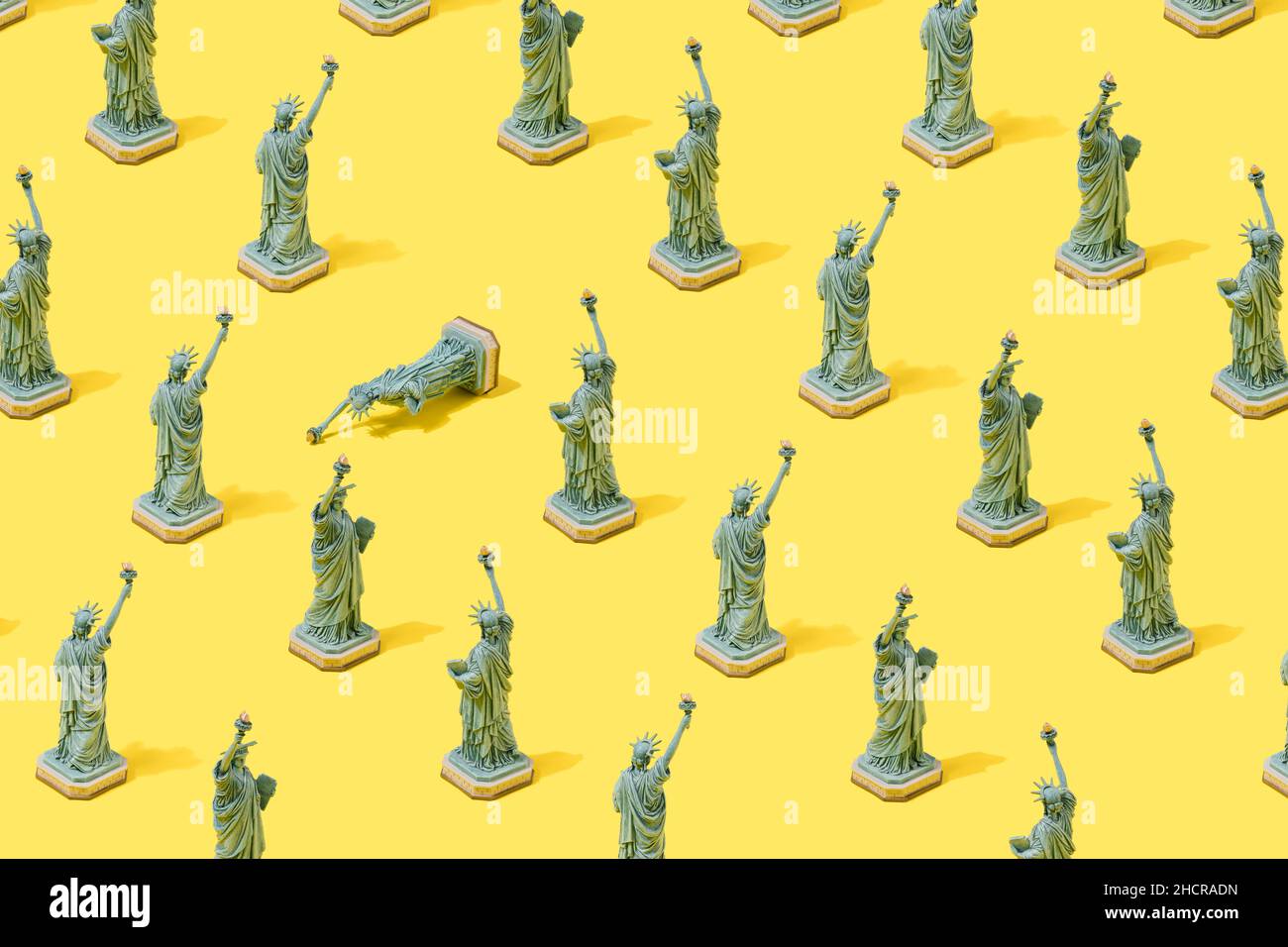 Statue of liberty figurine pattern on strong yellow background. USA ...