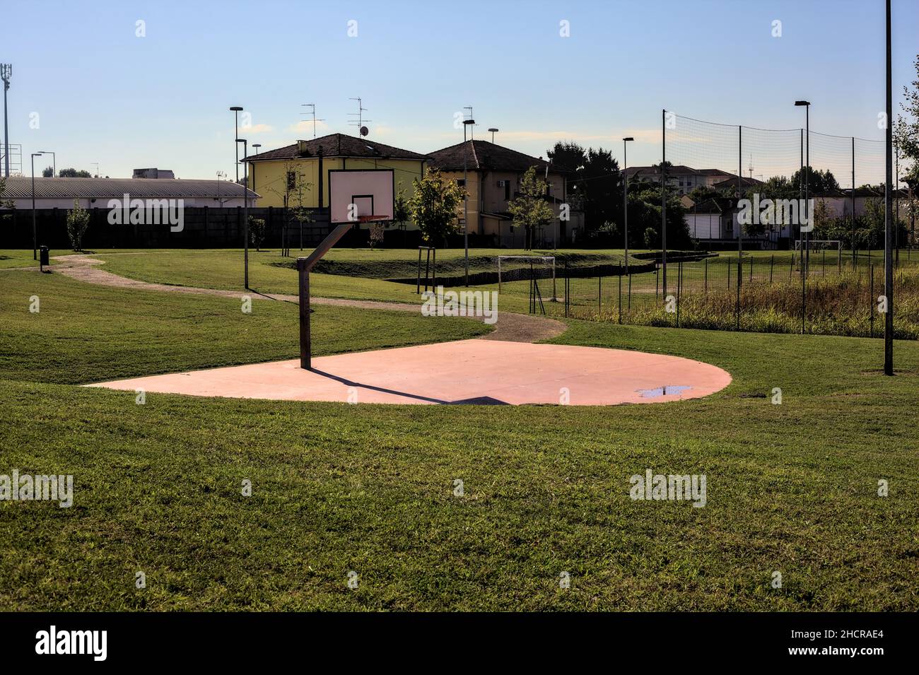 Basketball hoop in a park in a residential area Stock Photo - Alamy