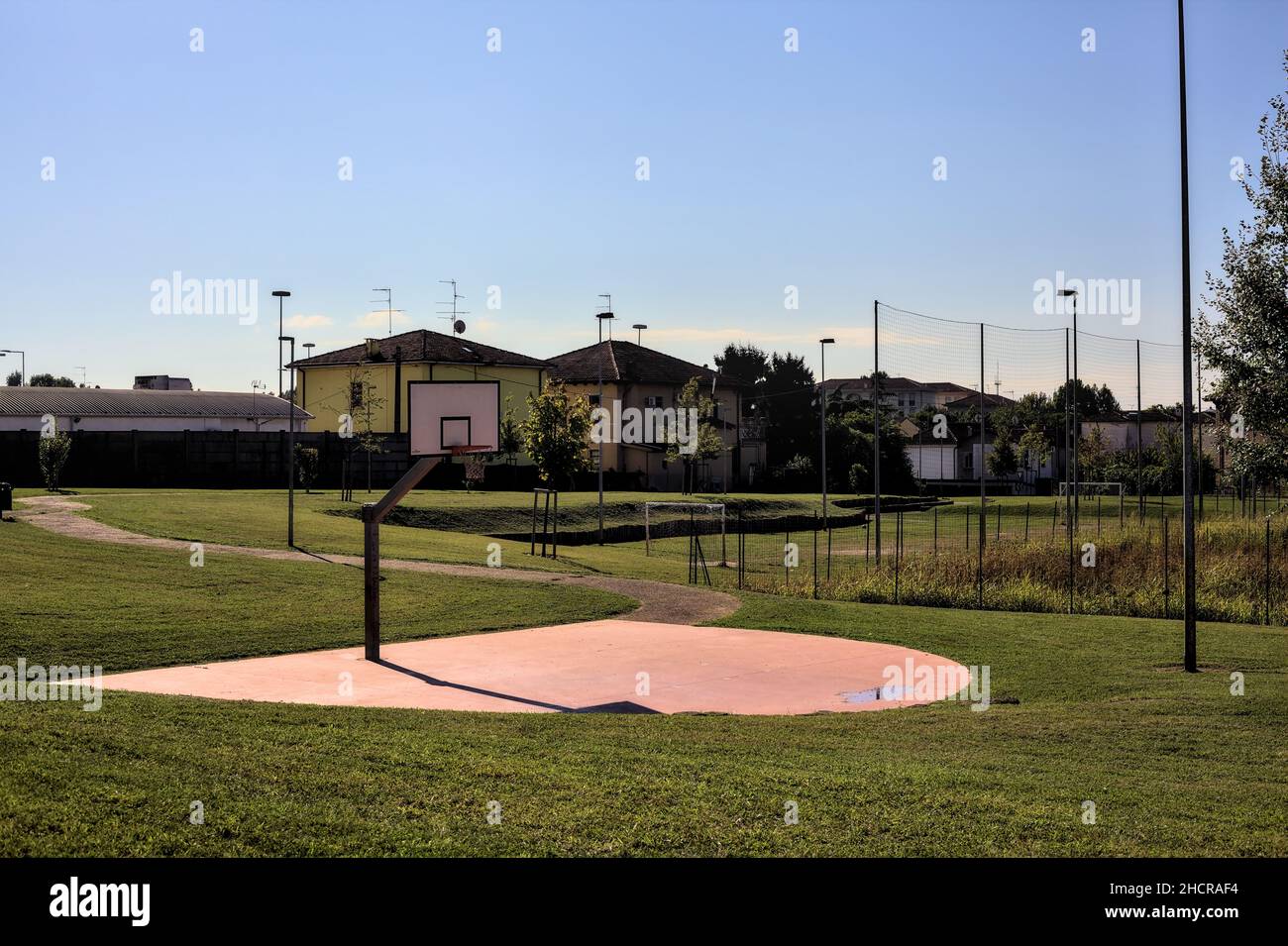 Basketball hoop in a park in a residential area Stock Photo - Alamy