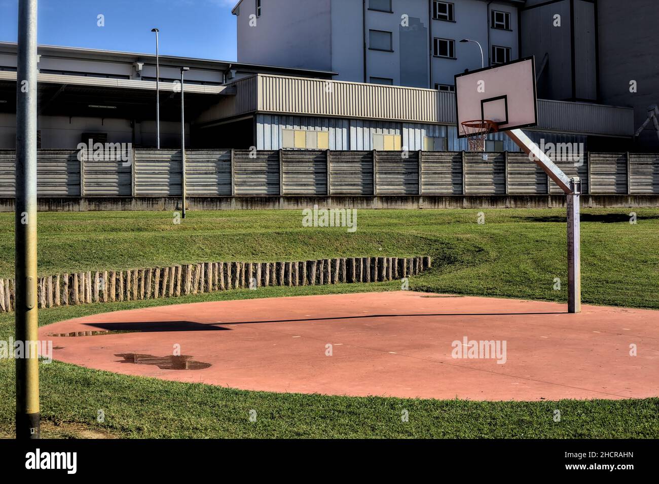 Basketball hoop in a park in a residential area Stock Photo - Alamy