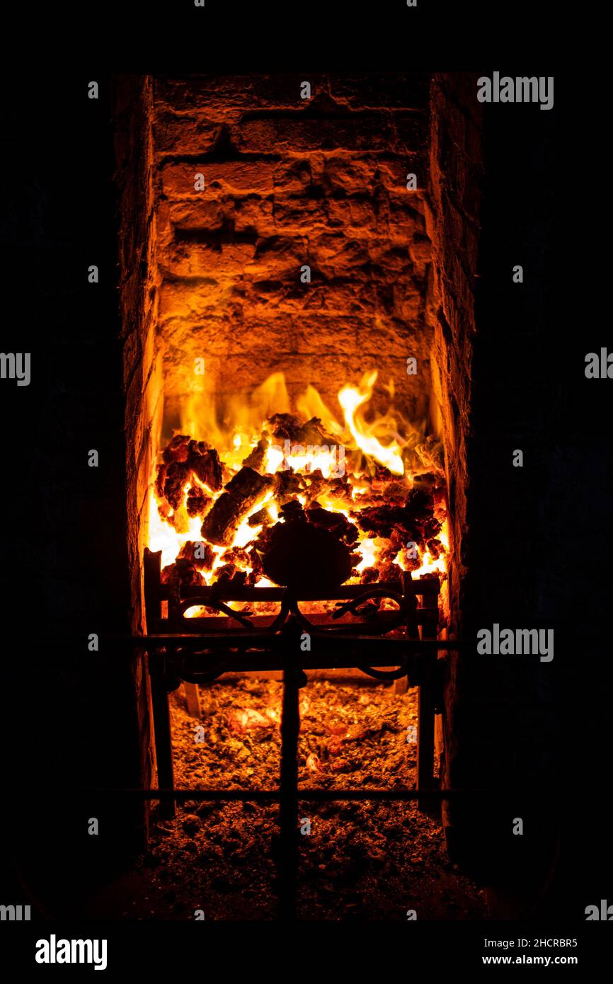 flames of roaring coal fire in a fire place at Beamish Village Stock ...