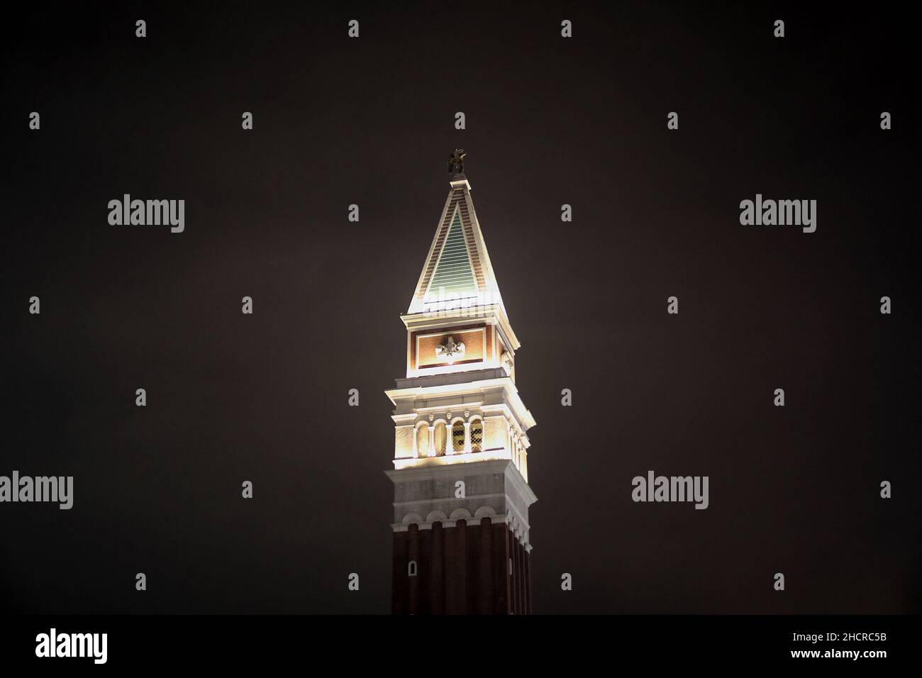 Exterior view of an illuminating building on a night sky background ...