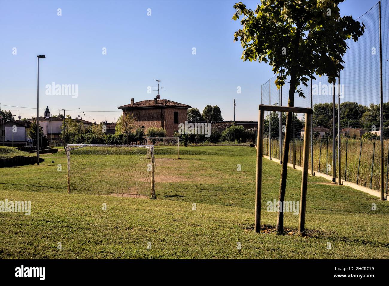 Football field in a small park of a residential area Stock Photo - Alamy