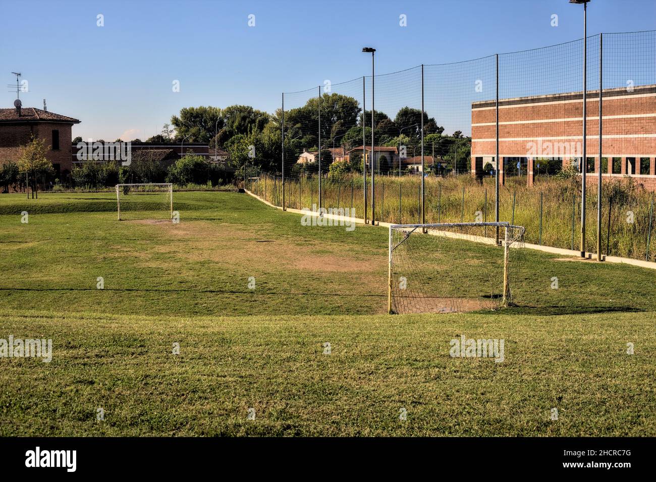 Football field in a small park of a residential area Stock Photo - Alamy