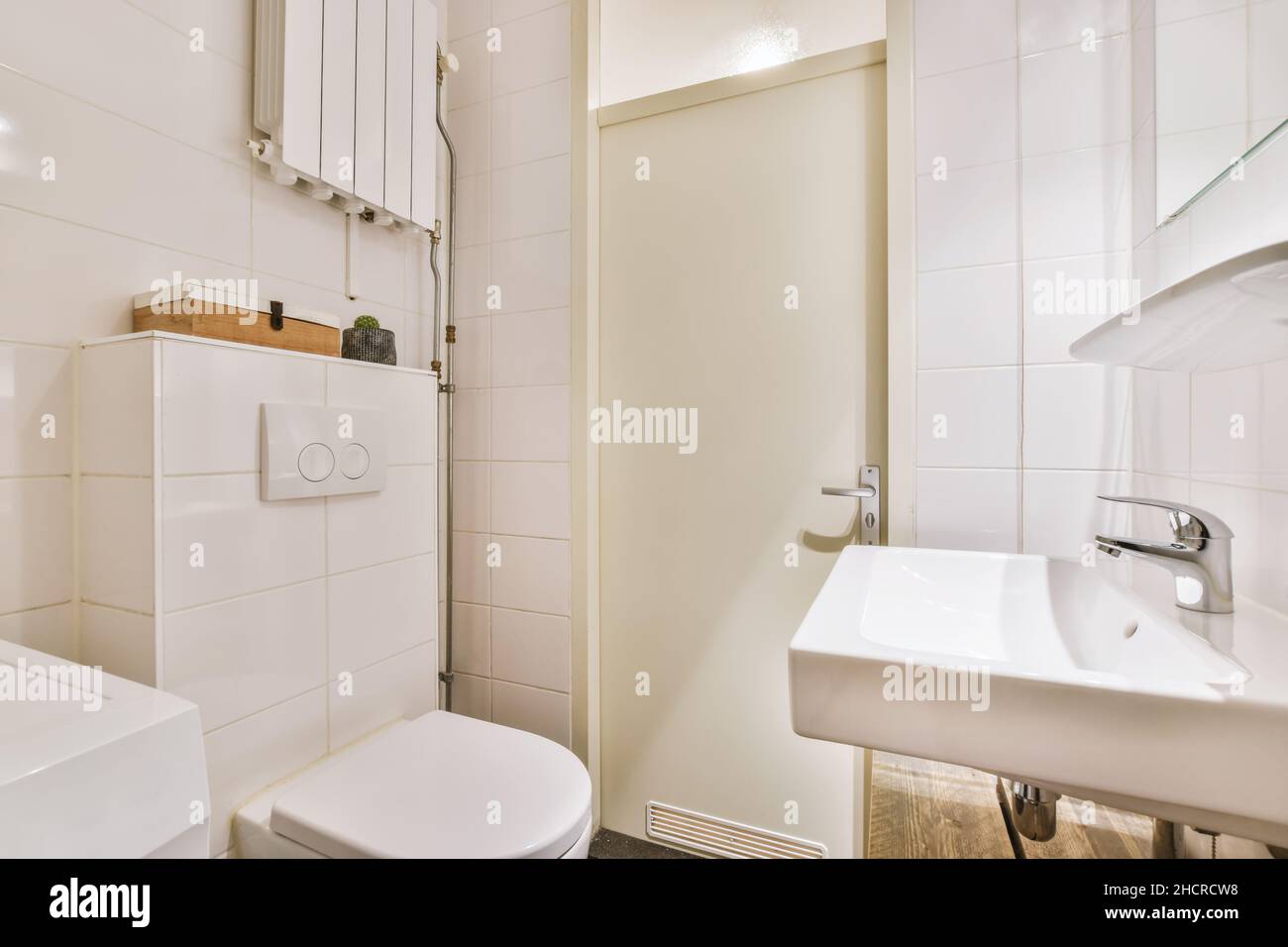 Interior of small clean restroom in miniature style Stock Photo - Alamy
