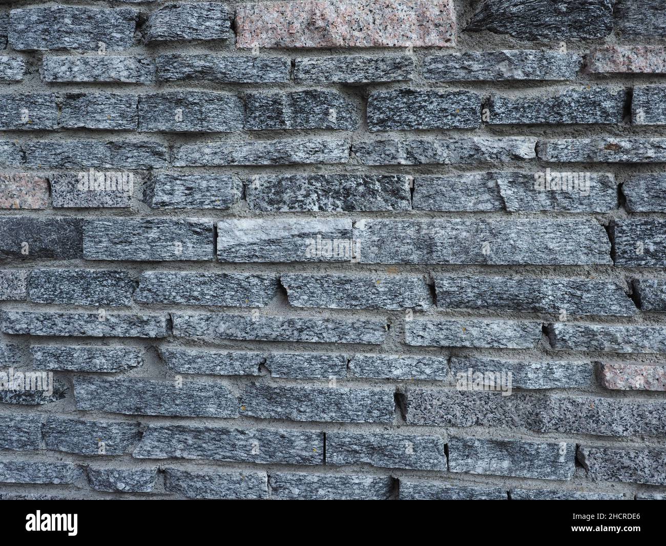 dark grey stone wall useful as a background Stock Photo - Alamy